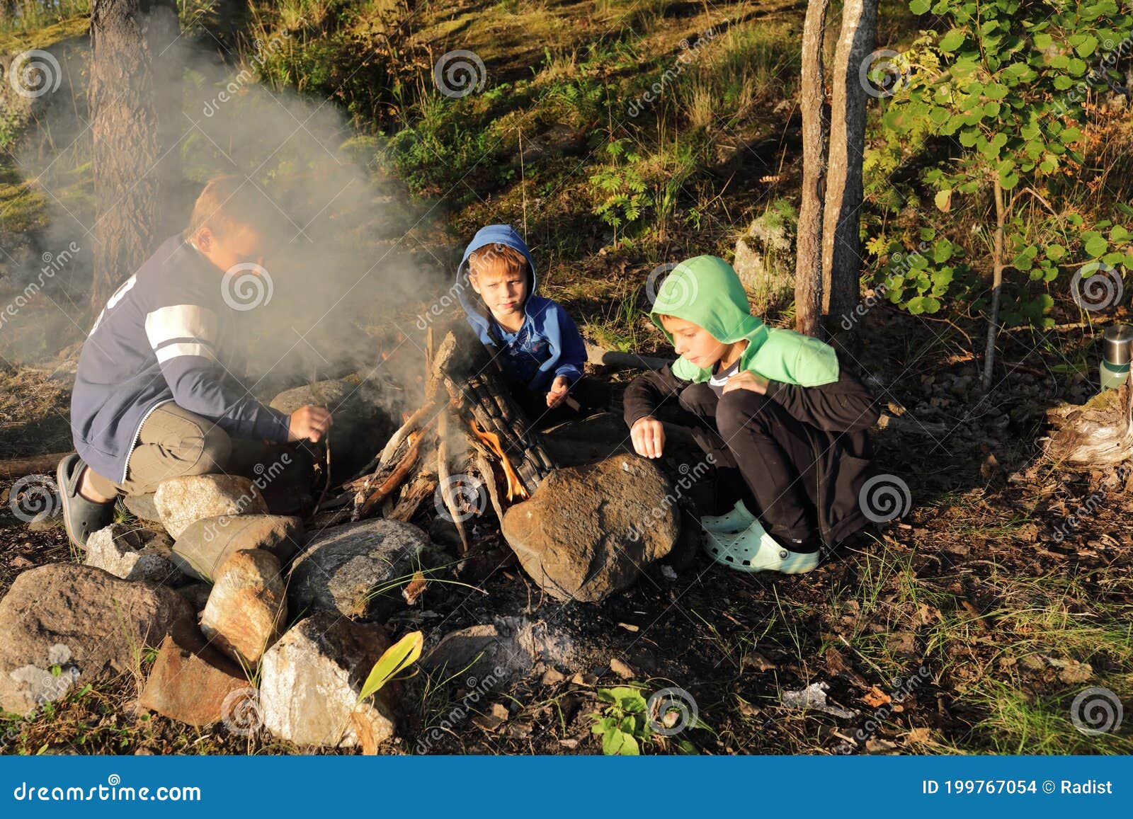 Boys by Fire in Forest in Evening Stock Photo - Image of karelia ...