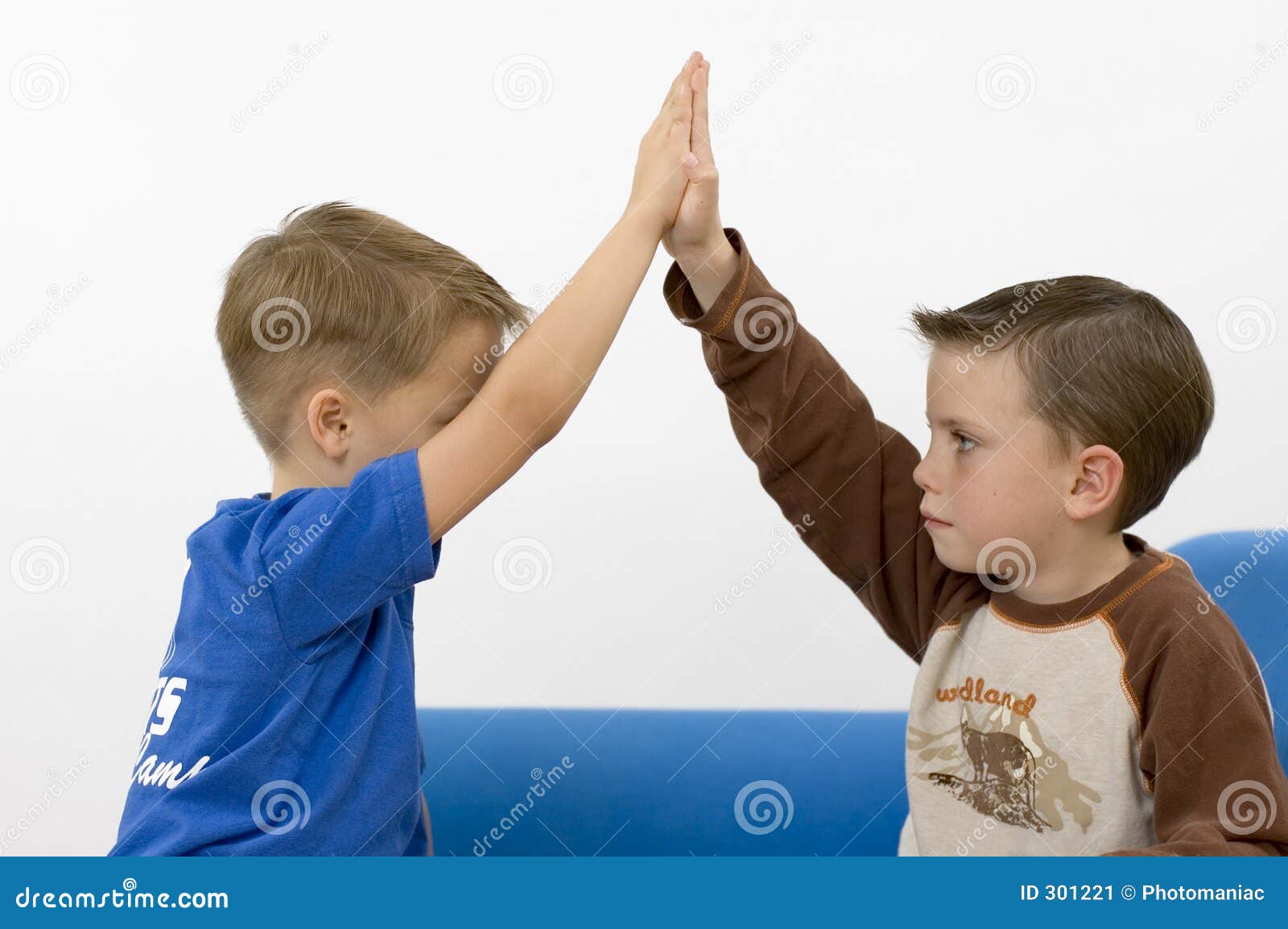 Boys giving five stock image. Image of competition, faces - 301221