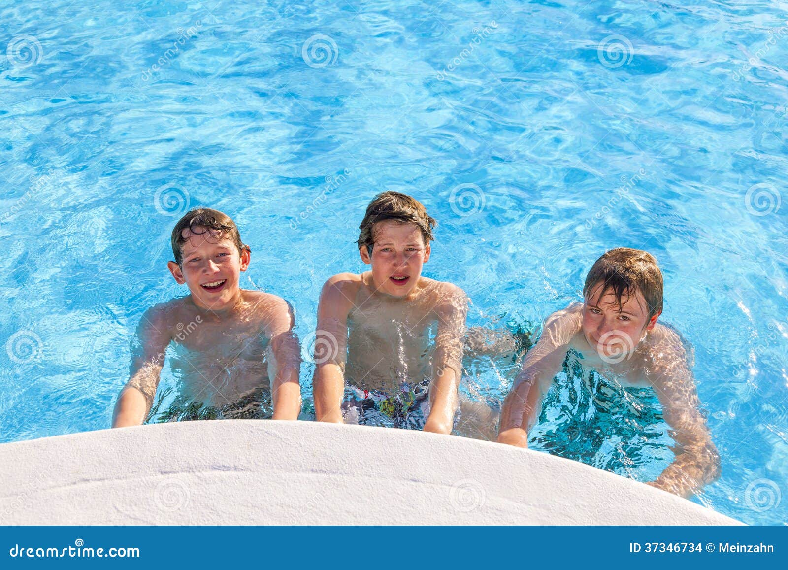 Boys have fun in the pool stock photo. Image of joyful - 37346734