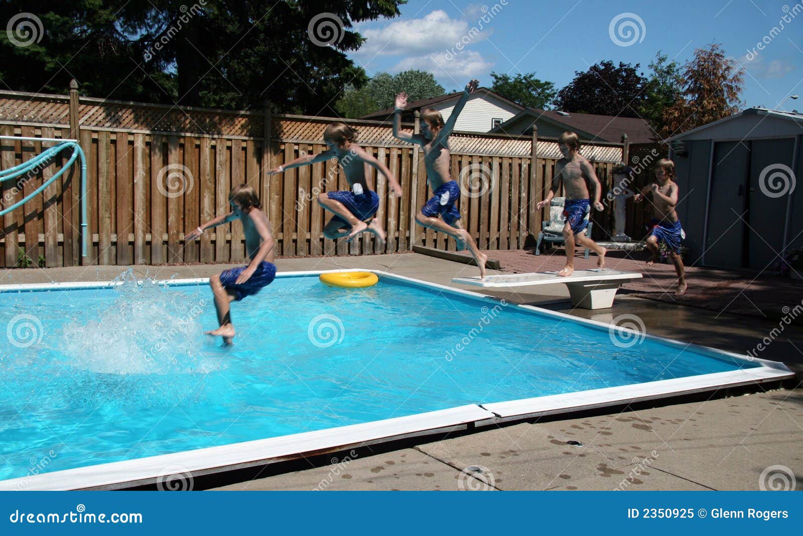 Boys Jumping into Pool stock image. Image of boys, summer - 2350925