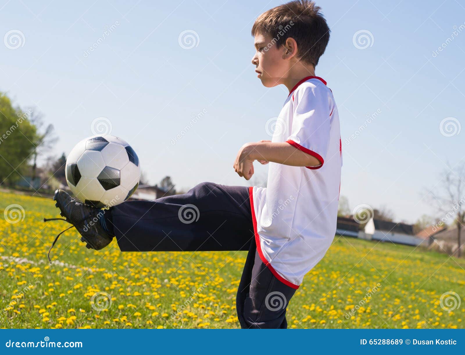 Boys kicking football stock image. Image of kicking, children - 65288689