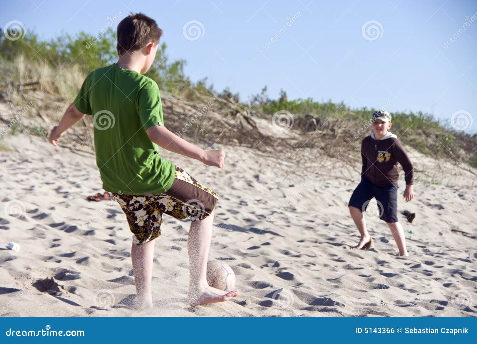 Boys play Beach football stock photo. Image of shooting - 5143366