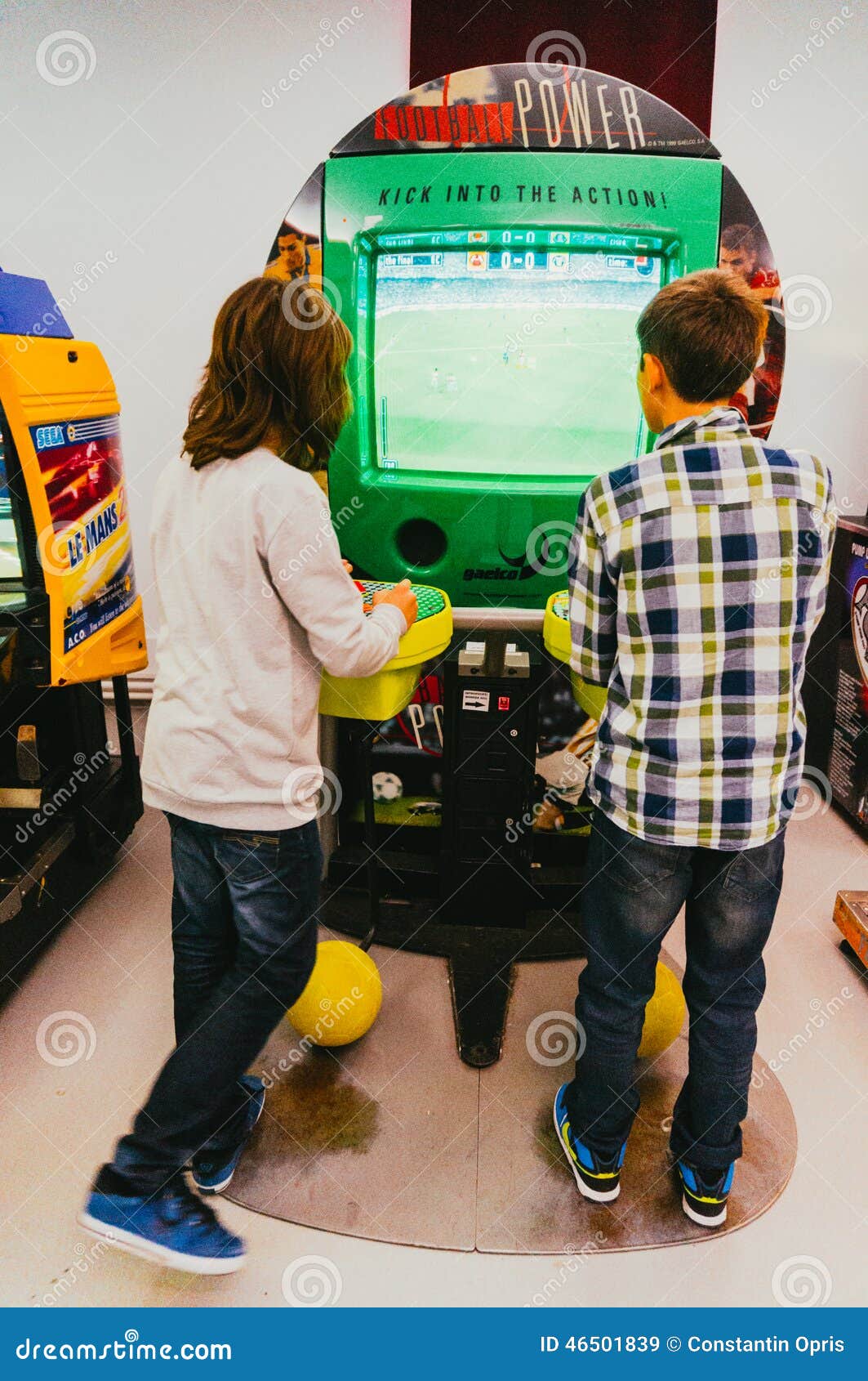 Boys playing arcade game editorial stock image. Image of competition ...
