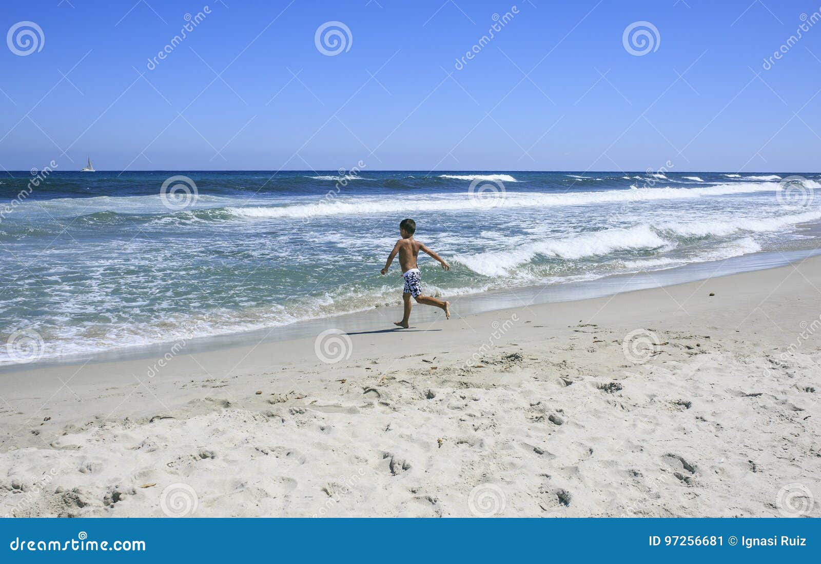 Boys playing on the beach stock image. Image of child - 97256681