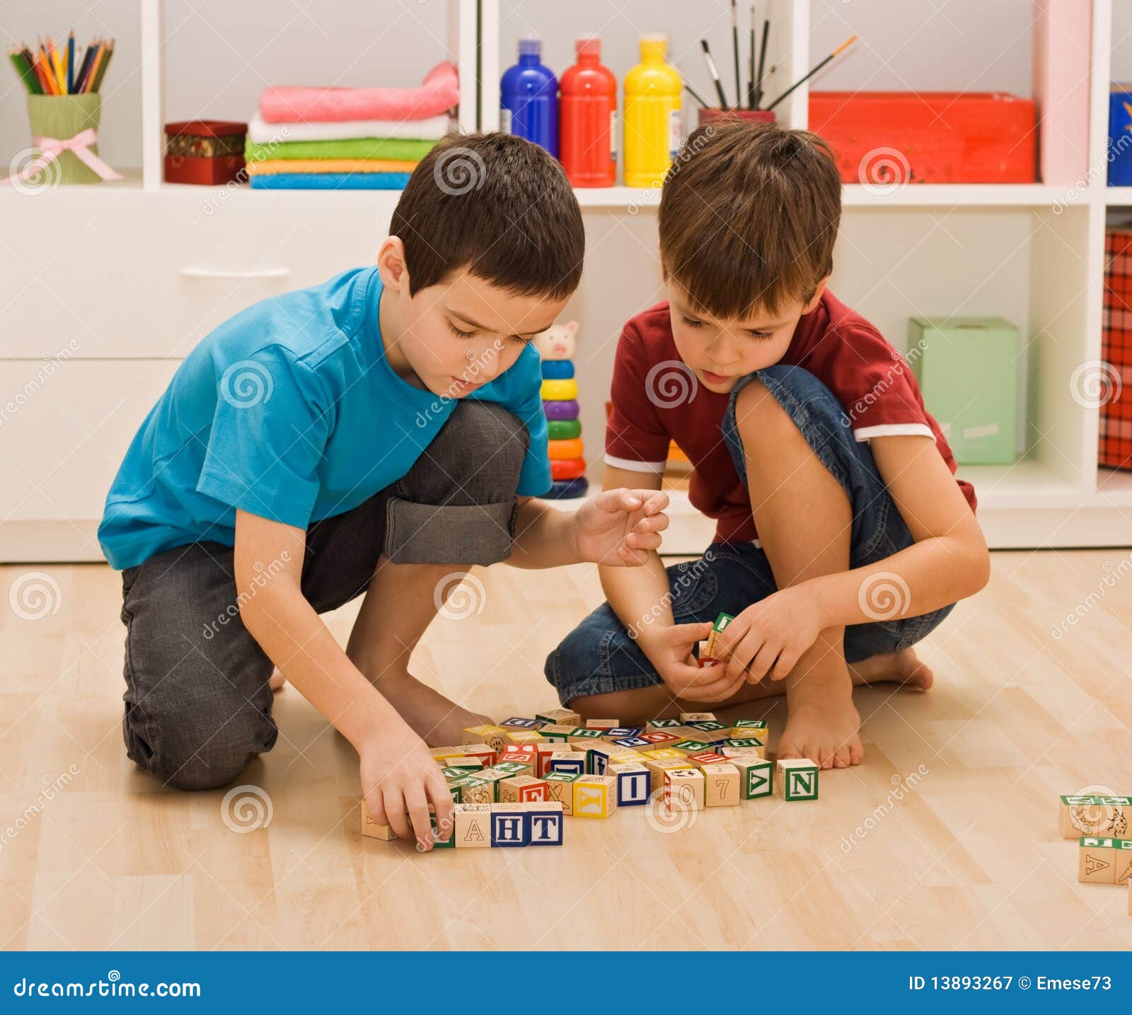 Boys playing with blocks stock image. Image of game, blue - 13893267