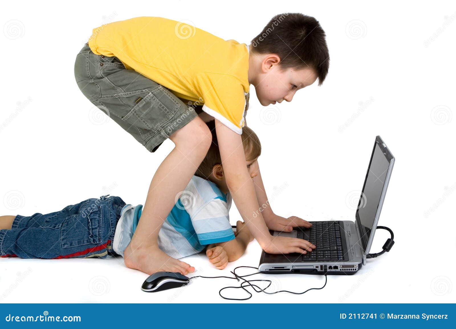 Boys Playing with Laptop stock image. Image of concentrating - 2112741