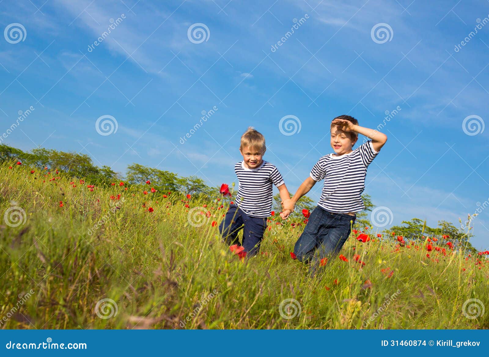 Boys playing on the meadow stock photo. Image of together - 31460874