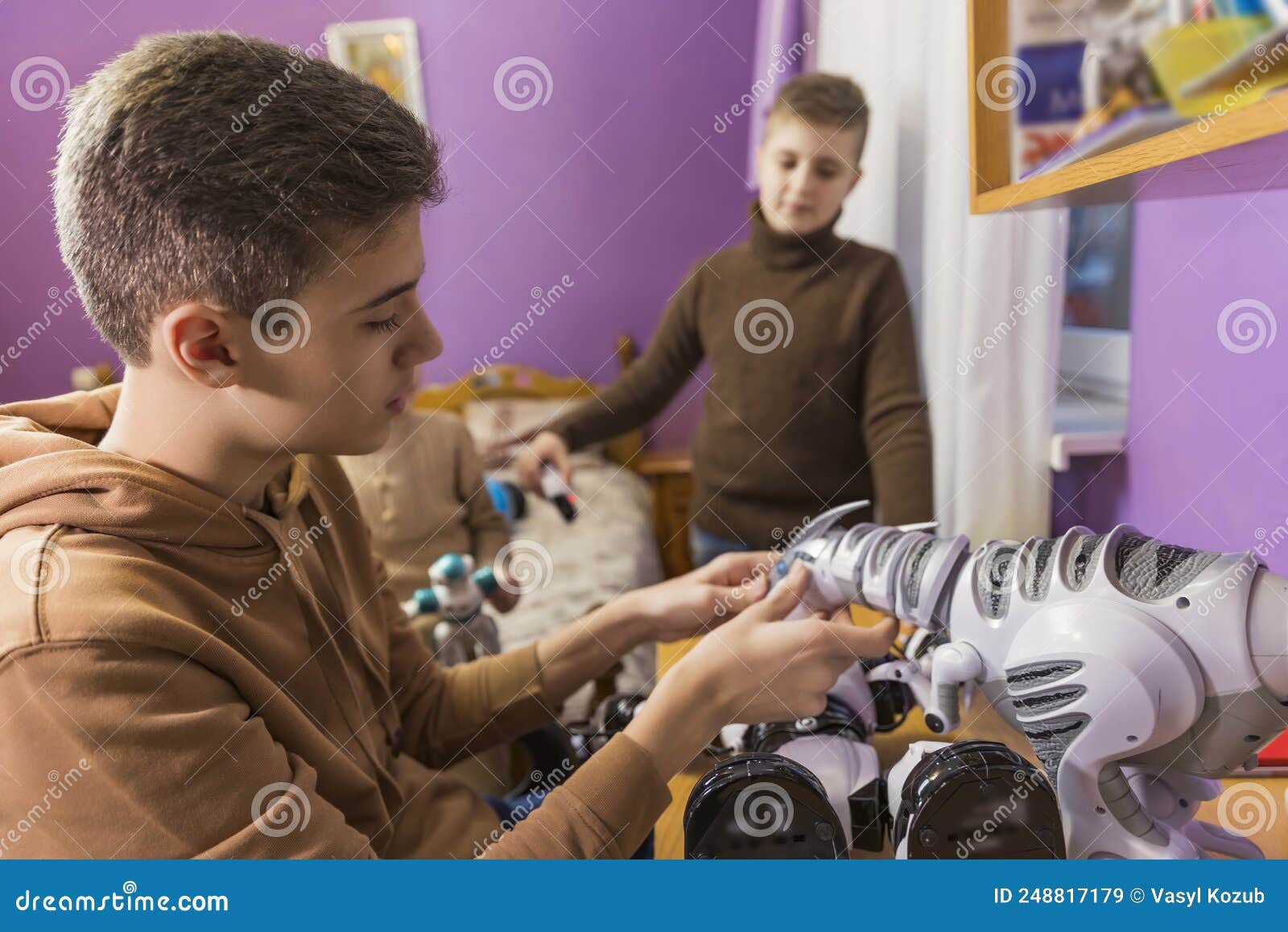 Boys playing with robots stock image. Image of geek - 248817179