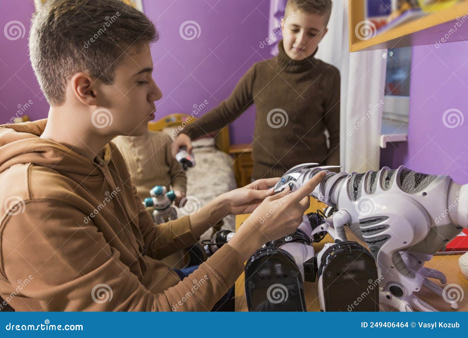 Boys playing with robots stock photo. Image of future - 249406464