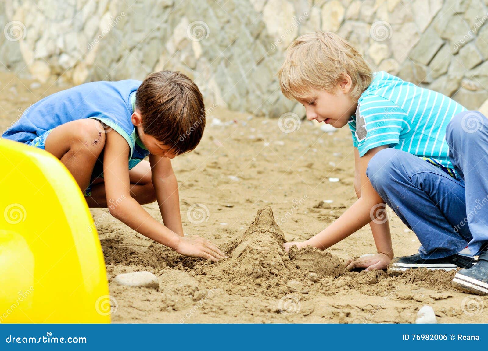 Boys playing sand stock photo. Image of curious, blond - 76982006