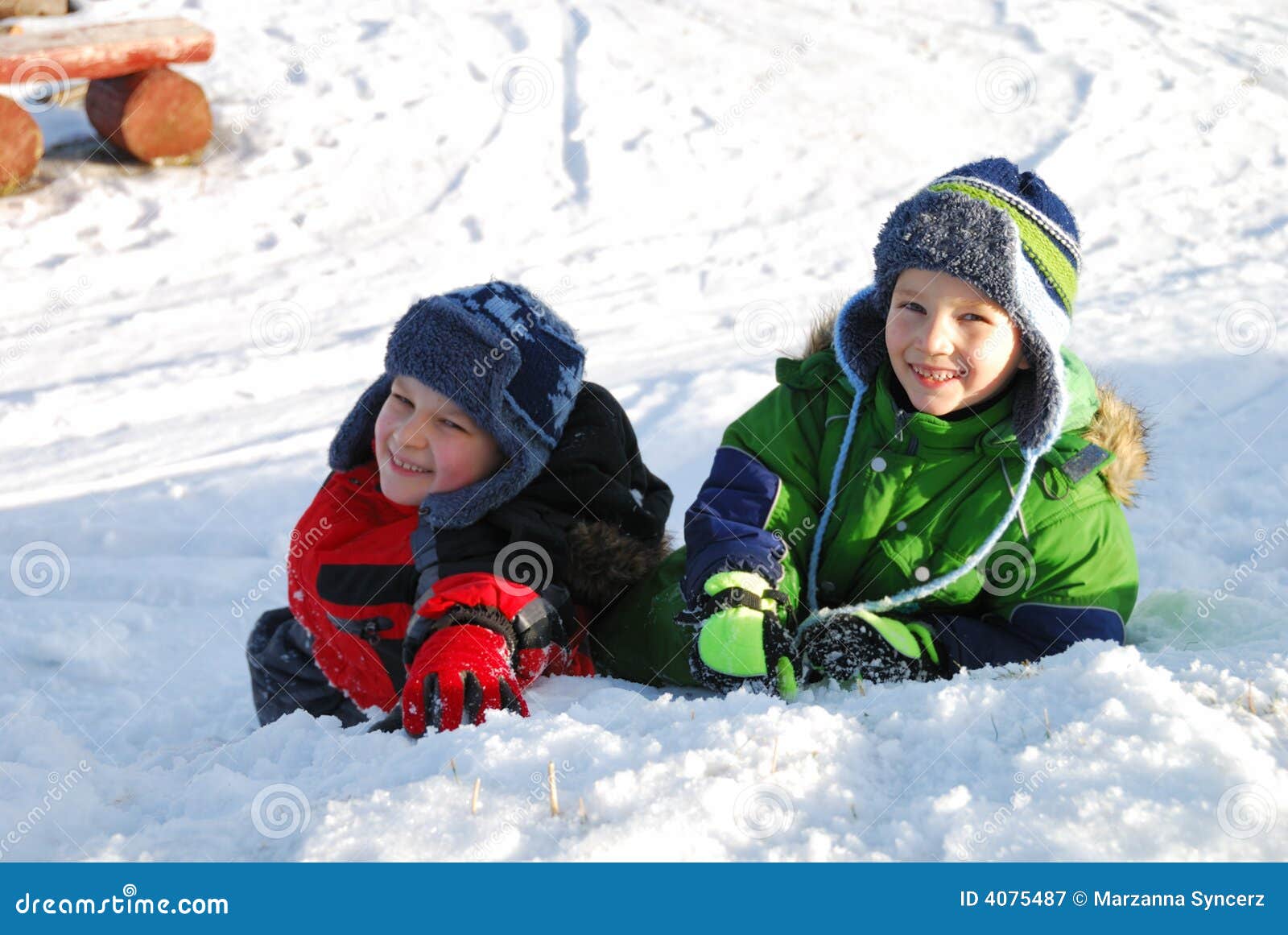 Boys playing in snow stock image. Image of looking, togetherness - 4075487