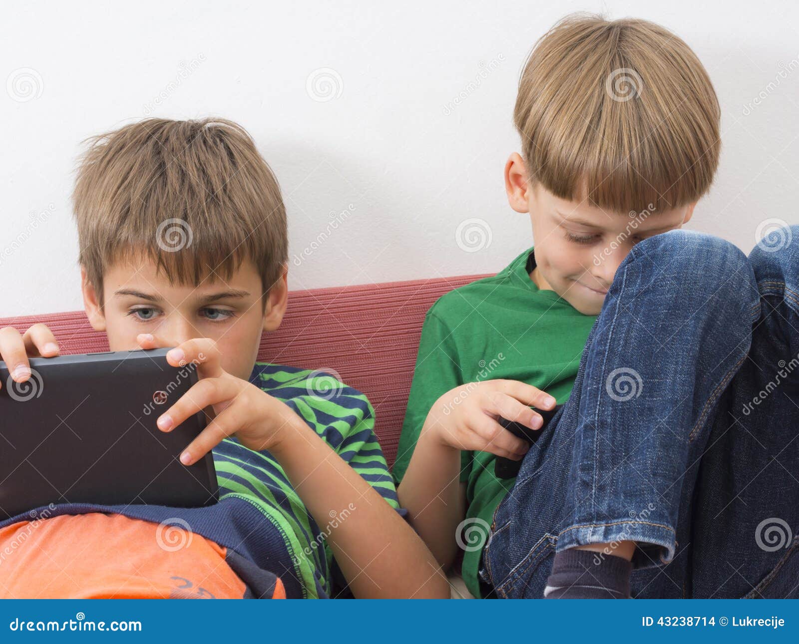Boys Playing Video Games on Tablet Computers Stock Photo - Image of ...