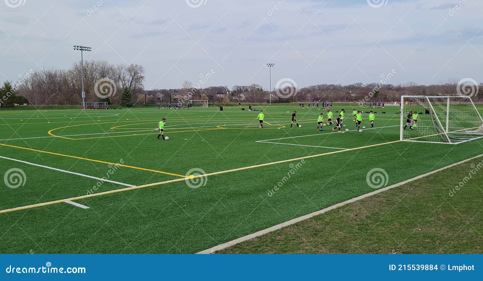 Boys Practicing Soccer on a Multi-use Ball Field Stock Footage - Video ...