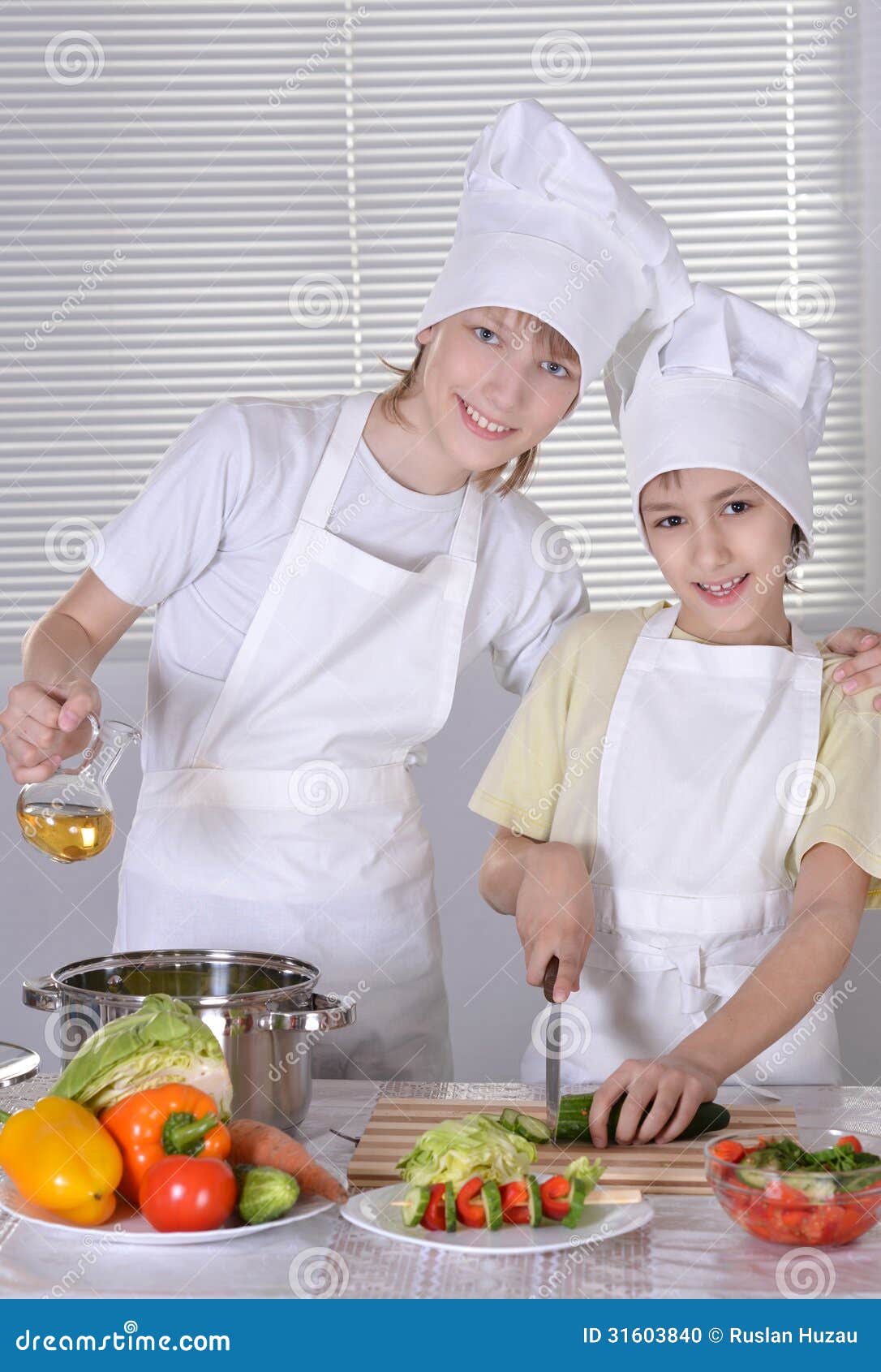 Boys preparing dinner stock photo. Image of positive - 31603840