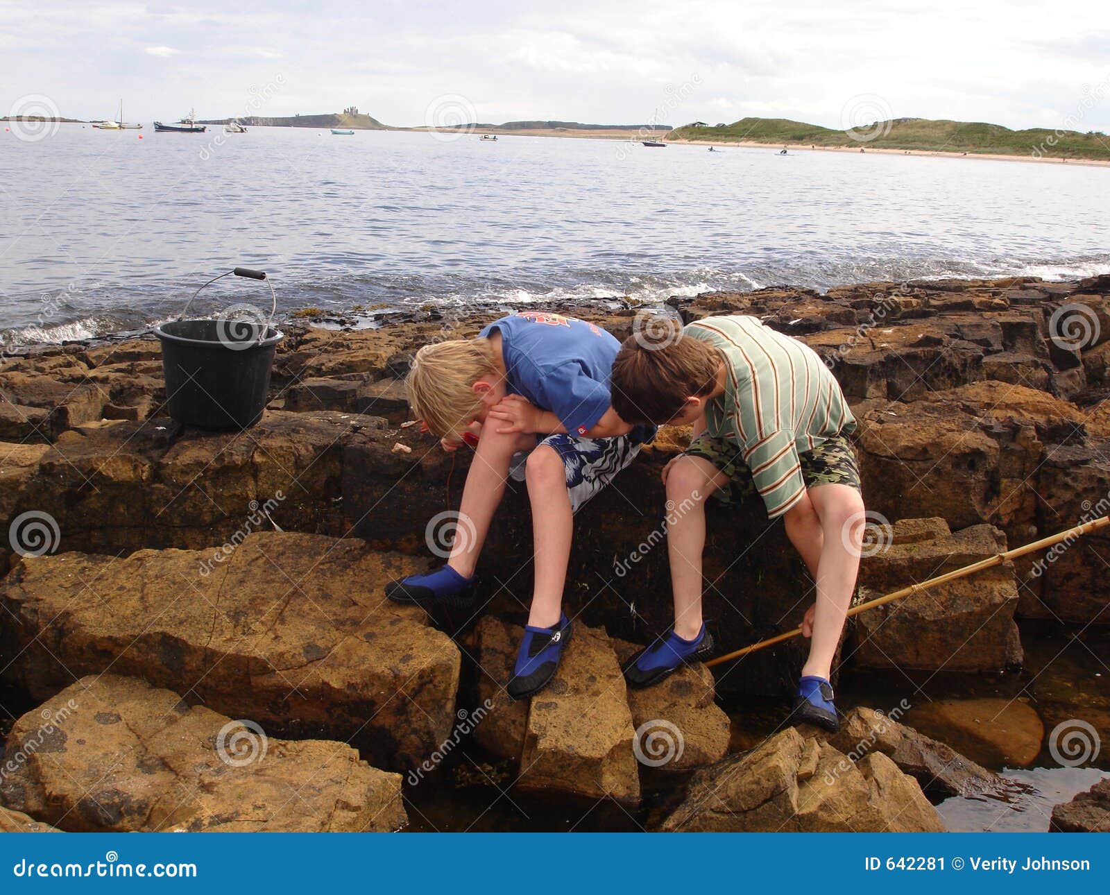 Rock Pooling With A Bucket And Net For Sea Creatures Royalty-Free Stock ...