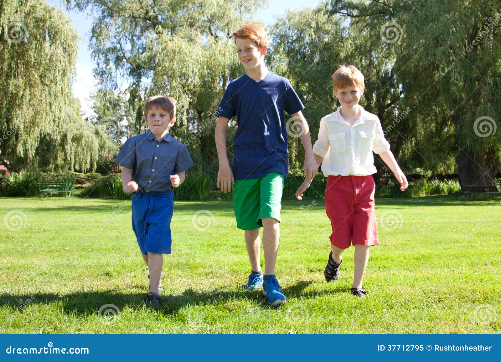 Boys running in park stock image. Image of children, grass - 37712795