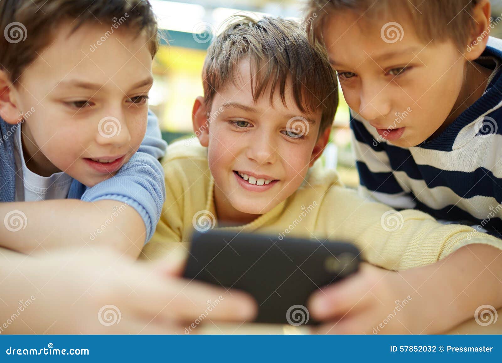 Boys with smartphone stock photo. Image of carefree, emotional - 57852032