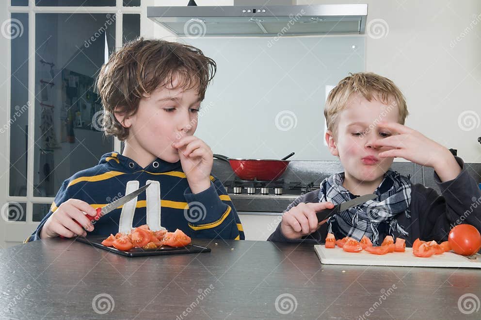 Boys tasting tomato stock image. Image of design, grow - 18053937