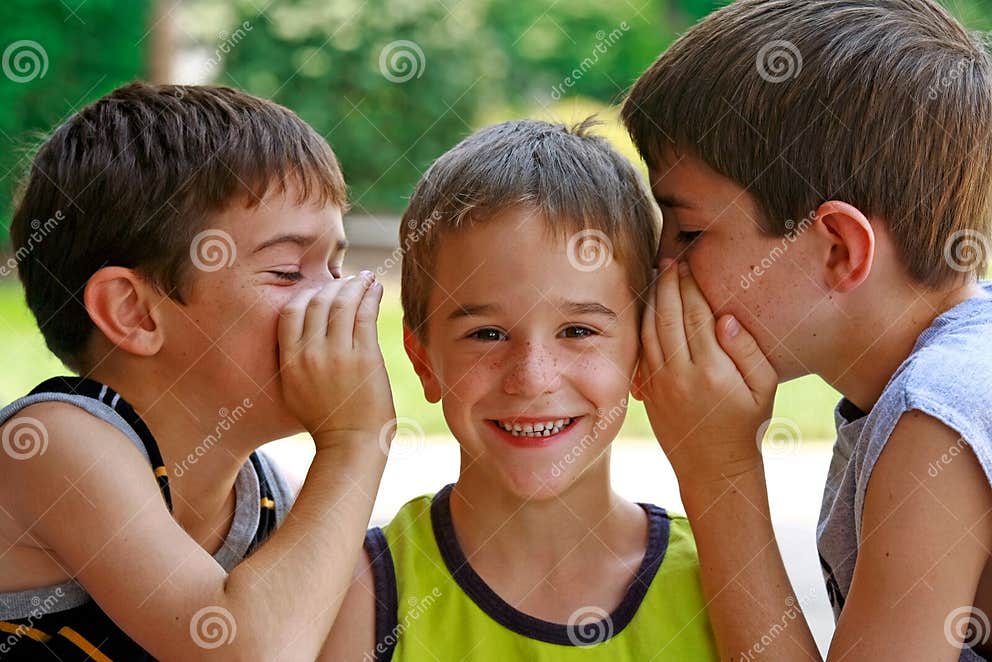 Boys Telling Secrets stock photo. Image of group, brother - 5119780
