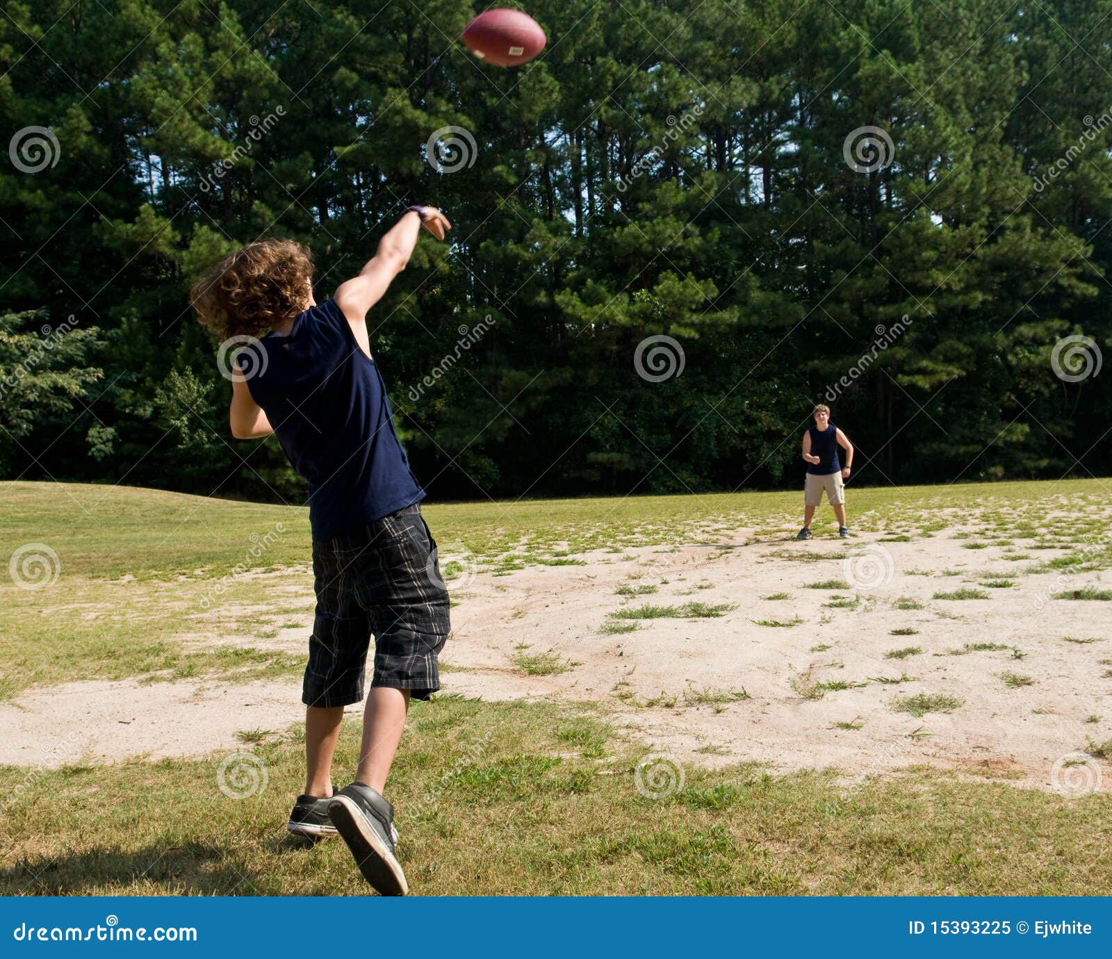 Boys Tossing Football Royalty Free Stock Photo - Image: 15393225