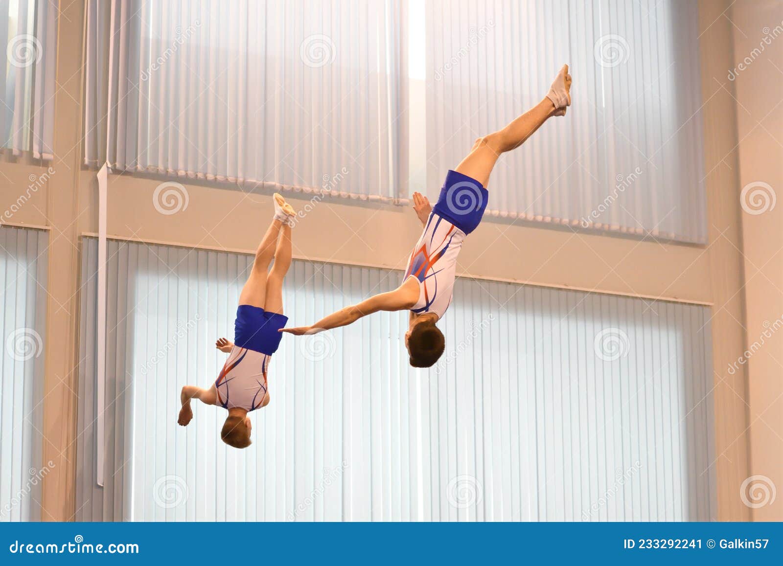 Boys Train in Synchronized Jumping on a Trampoline Stock Image - Image ...