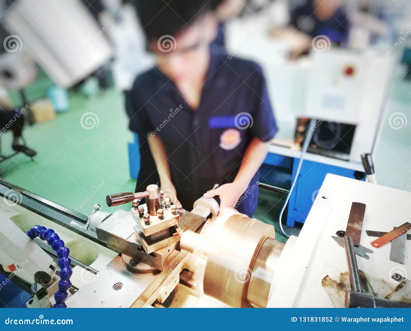 The Boys are Turning the Lathe To Iron the Iron into a Work Piece Stock ...