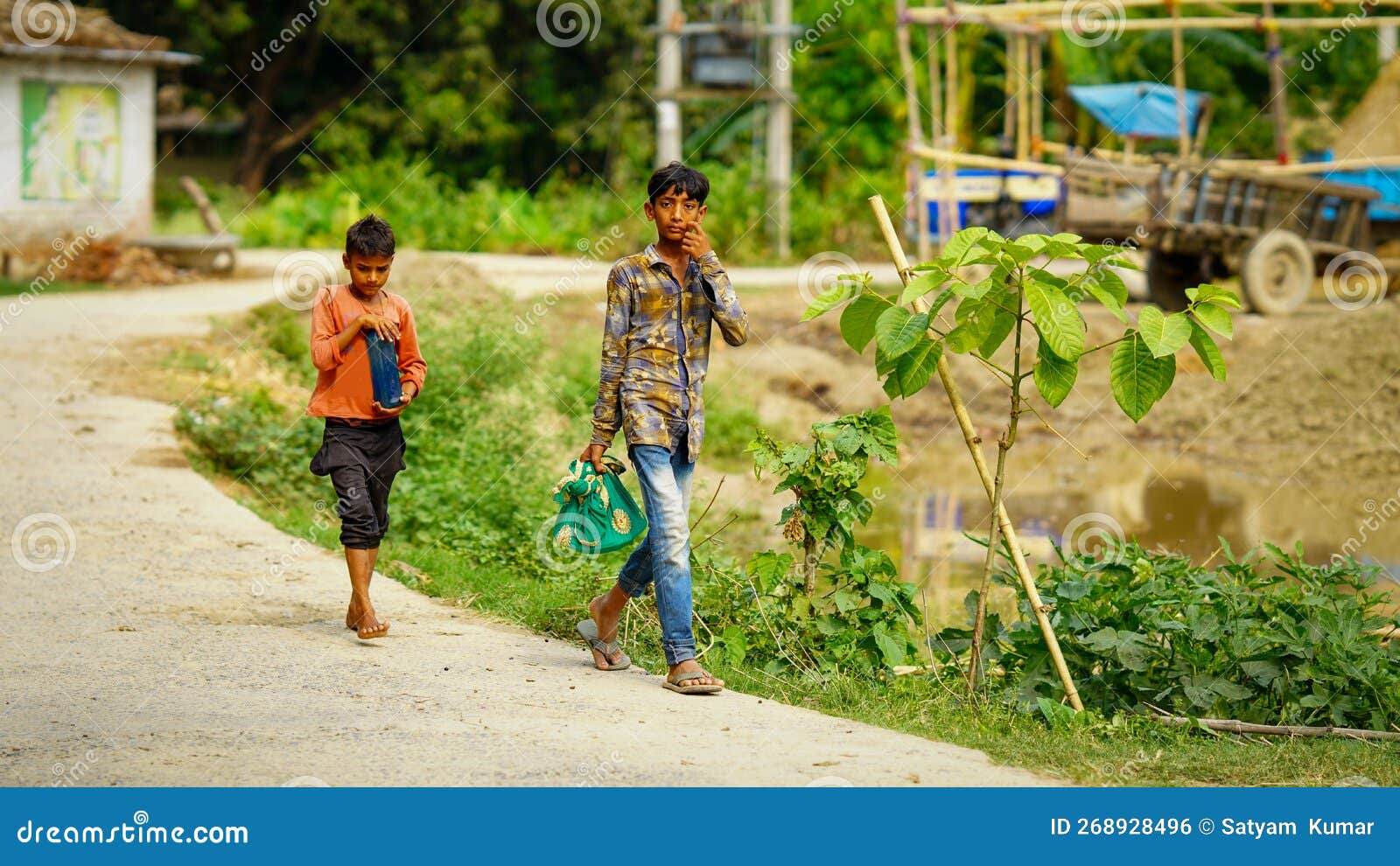 Boys walk on the road editorial photo. Image of human - 268928496