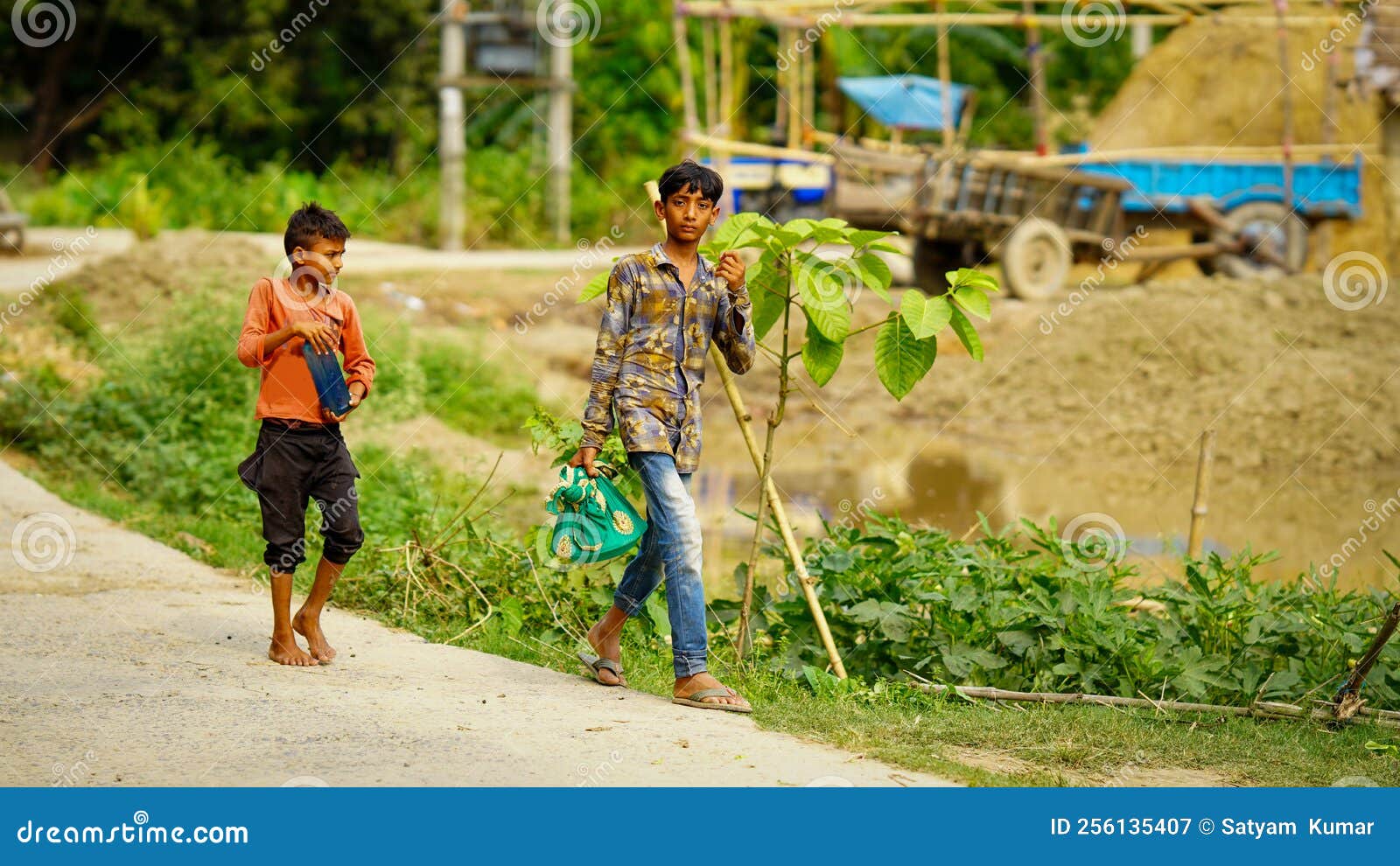 Boys walk on the road editorial photography. Image of life - 256135407