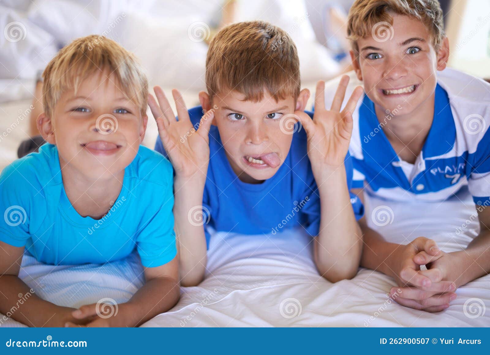 Boys Will Be Boys. Three Brothers Pulling Funny Faces at the Camera ...