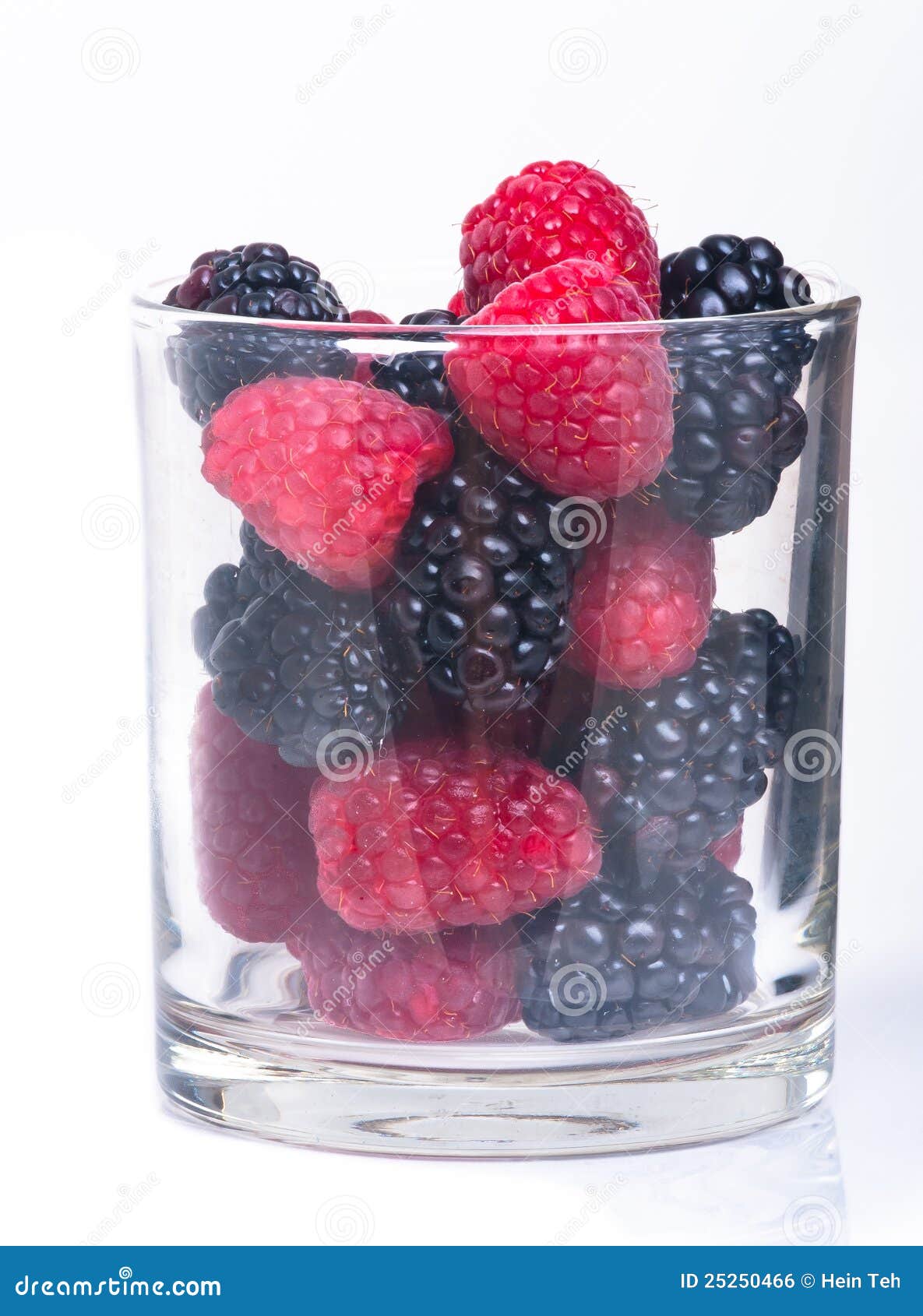 Boysenberries and Raspberries in the Clear Glass Stock Photo - Image of ...