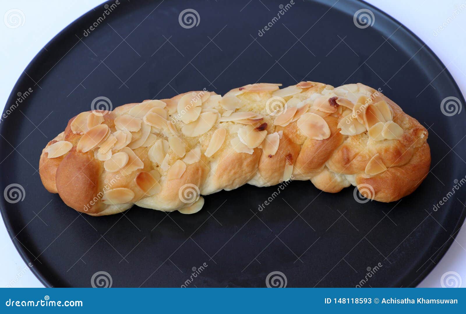 Braid Bread with Almond in the Black Round Plate Stock Image - Image of ...