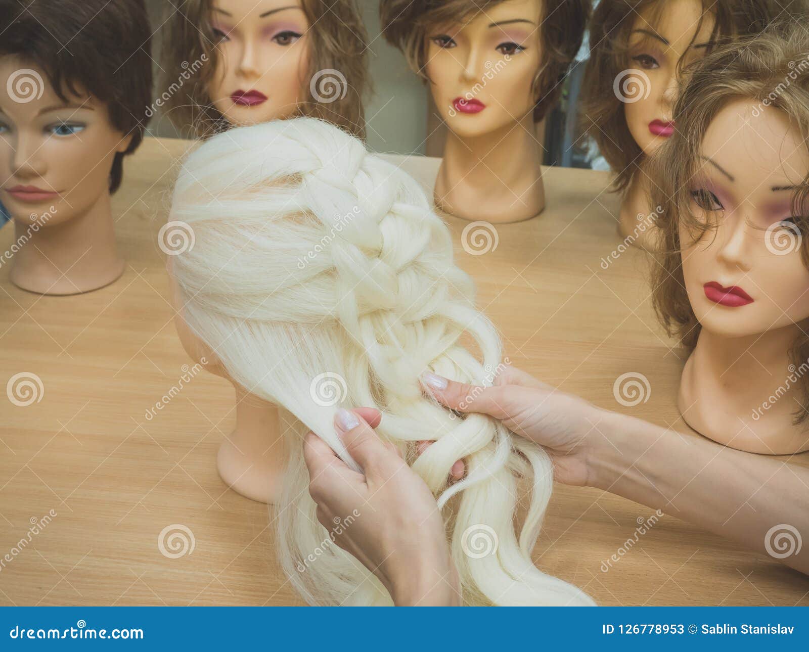 Braiding a Braid on a Mannequin. Training Braiding. Stock Image - Image ...