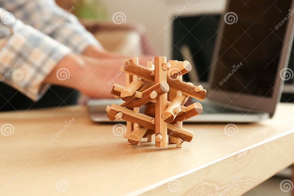 Brain Teaser on Wooden Table Stock Photo - Image of construction, idea ...