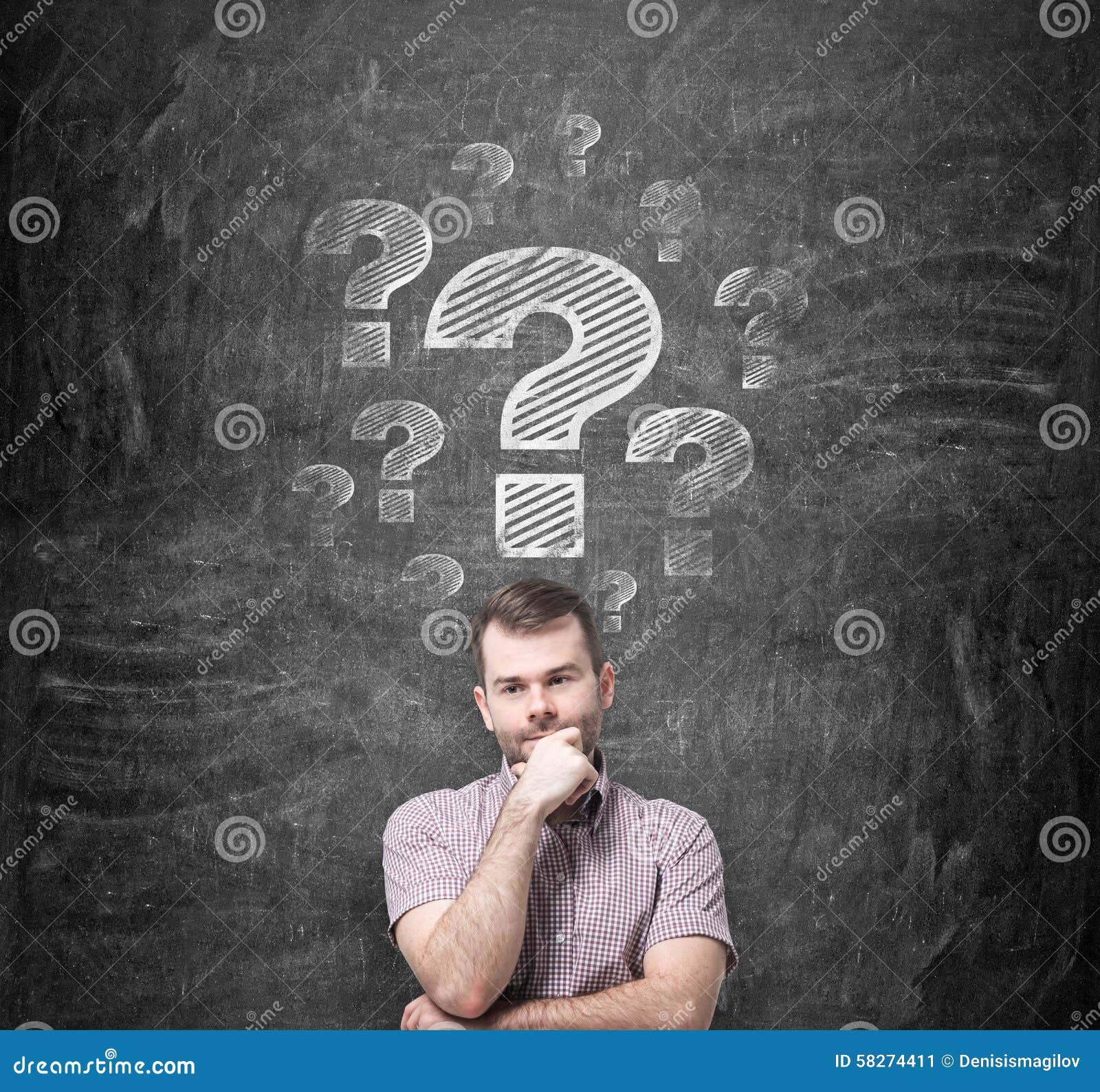 Brainstorming of Man. Question Marks are Drawn on the Black Chalkboard ...