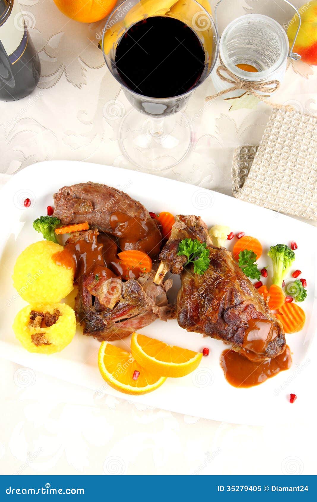 Braised Rabbit Meat with Potato Dumplings and Vegetables Stock Image ...