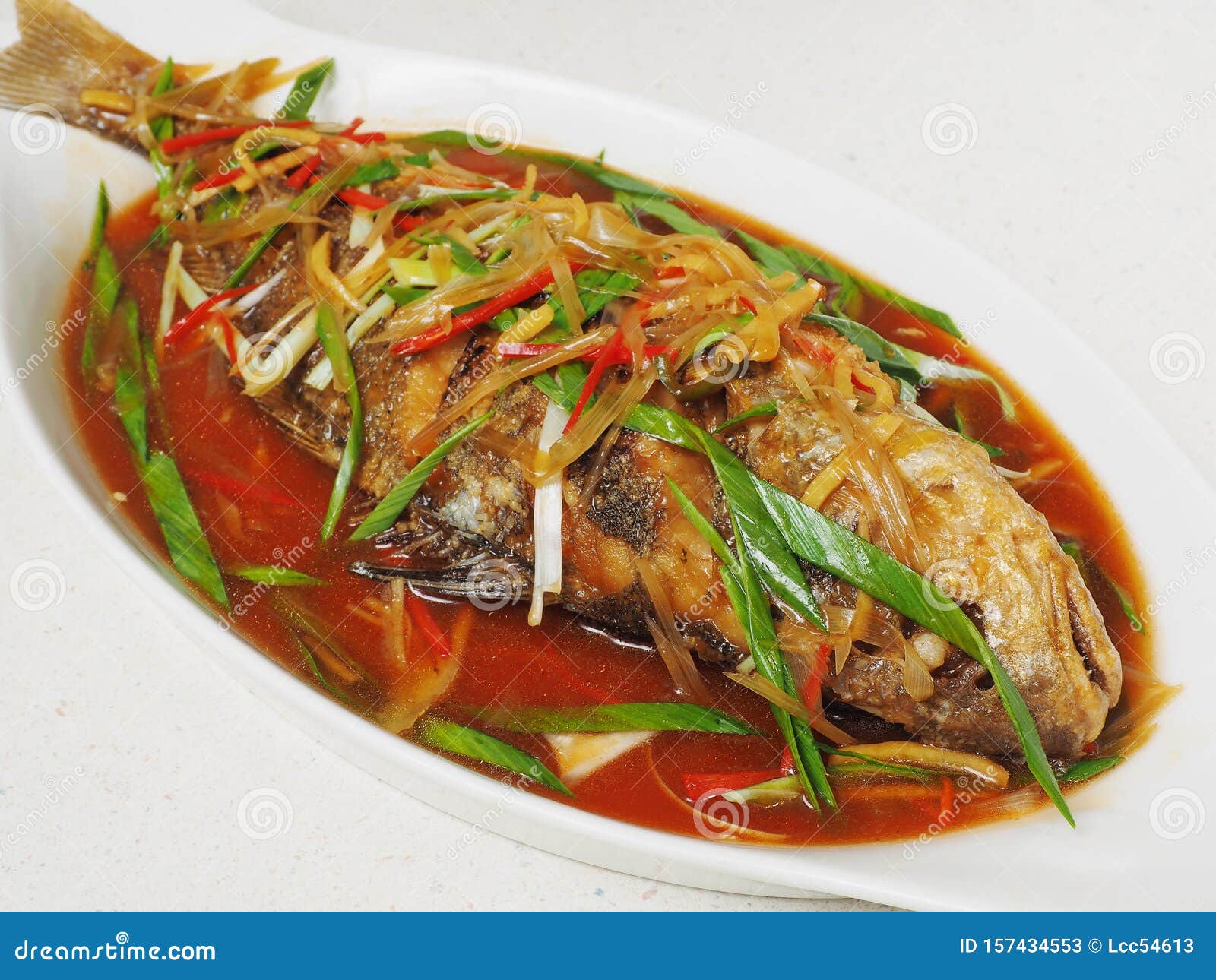 Braised Yellow Croaker in Soy Sauce Stock Image - Image of green ...