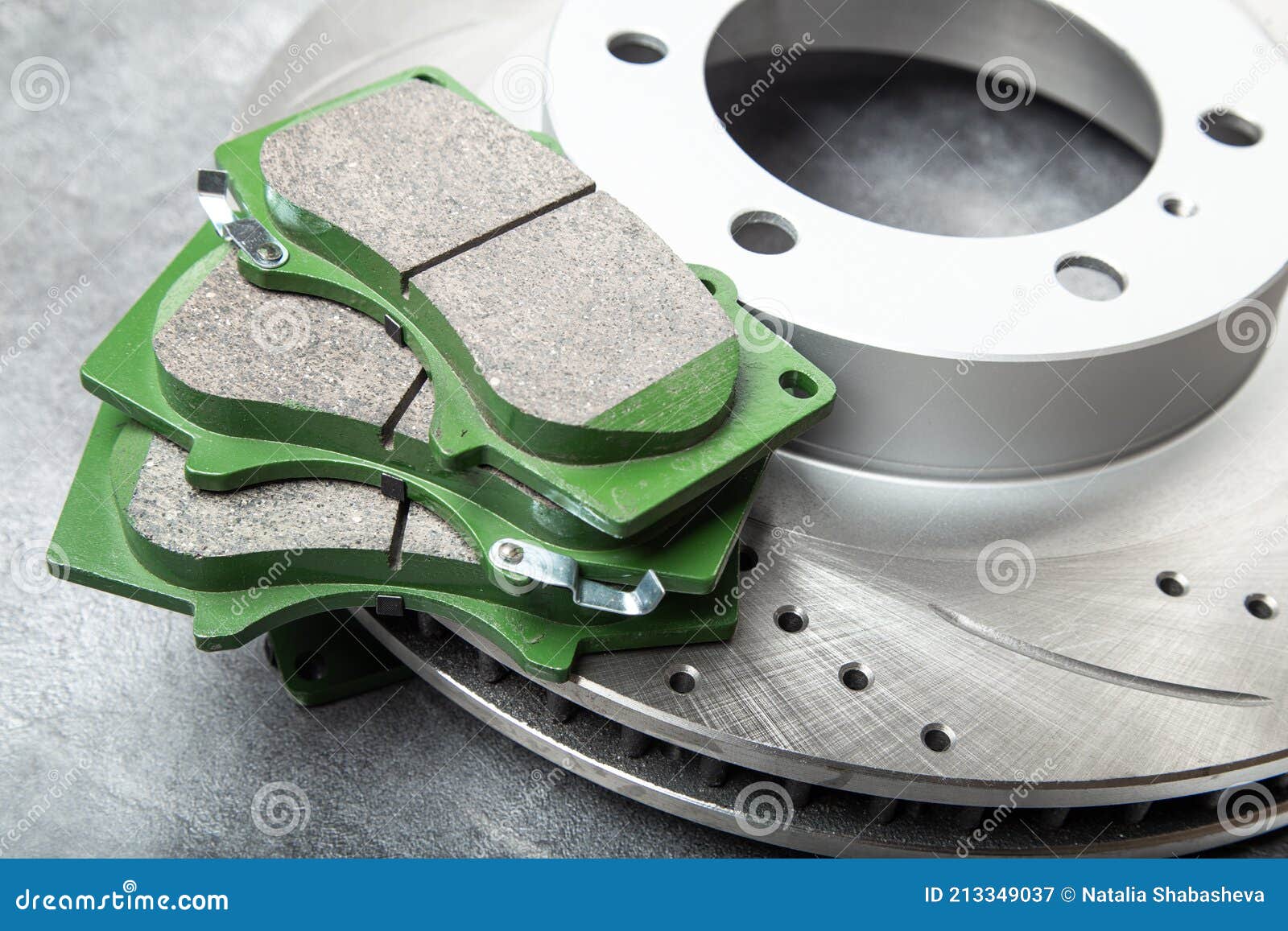 Brake Pads and Perforated Brake Discs on a Stone Gray Table Stock Image ...