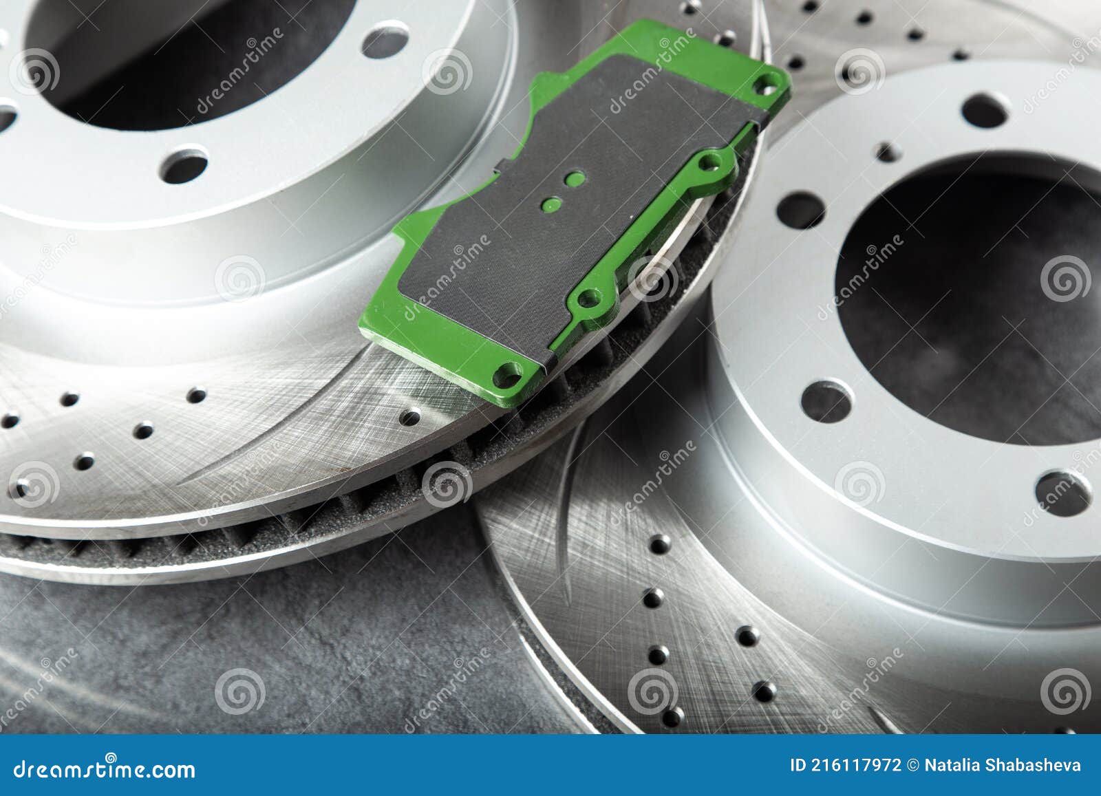 Brake Pads and Perforated Brake Discs on a Stone Gray Table Stock Photo ...