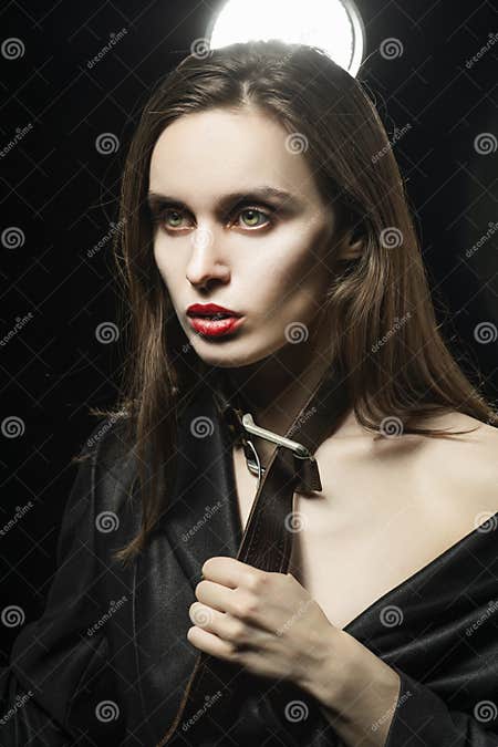 Braless Girl With Red Lips Wearing A Black Unbuttoned Blazer And A Men