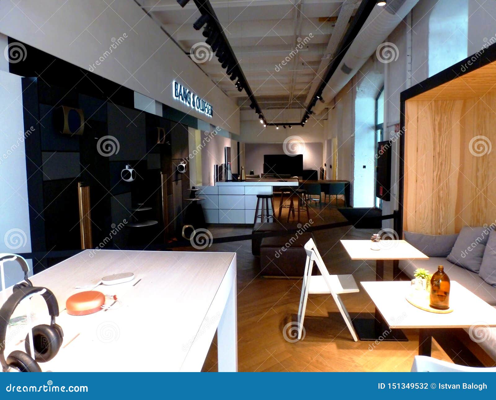 Brand Display Interior with Wooden Table and Electronics on the Sides ...