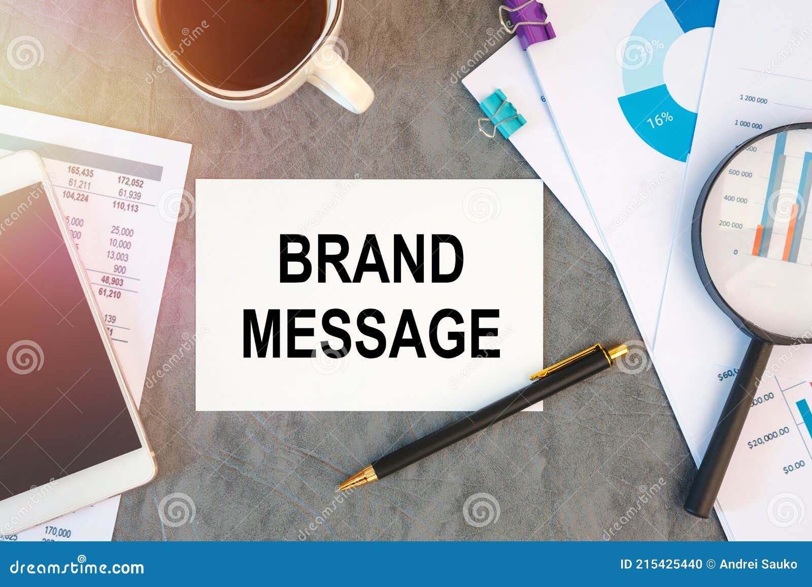 BRAND MESSAGE is Written in a Document on the Office Desk, Coffee ...