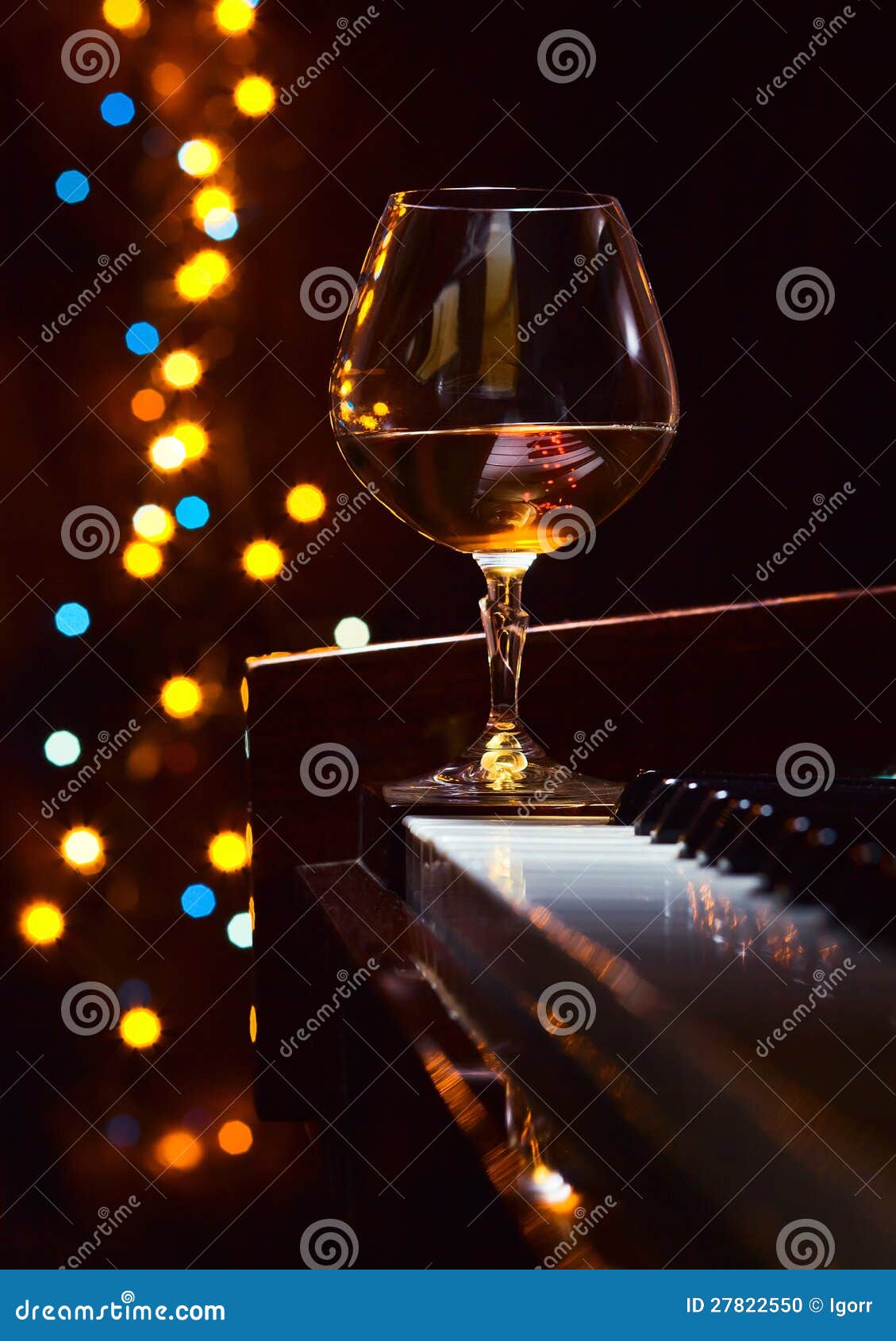Brandy on a piano stock photo. Image of musical, ebony - 27822550