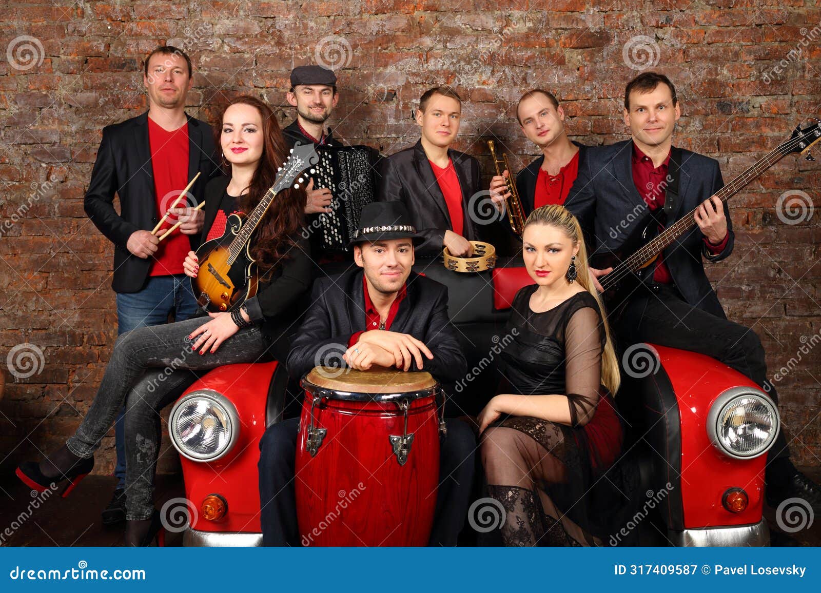 Brass Band of Eight People in Red and Black Stock Image - Image of ...