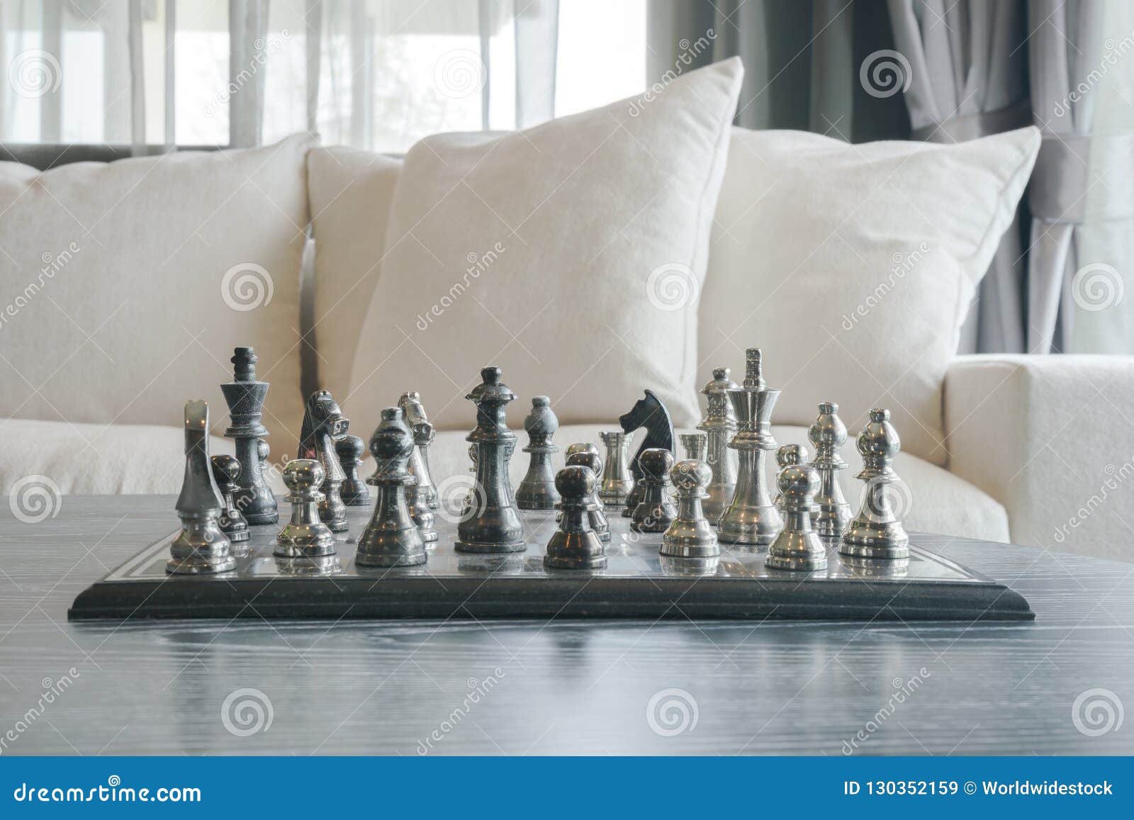 Brass Chess on Table with White Sofa Set in Living Room Stock Image ...