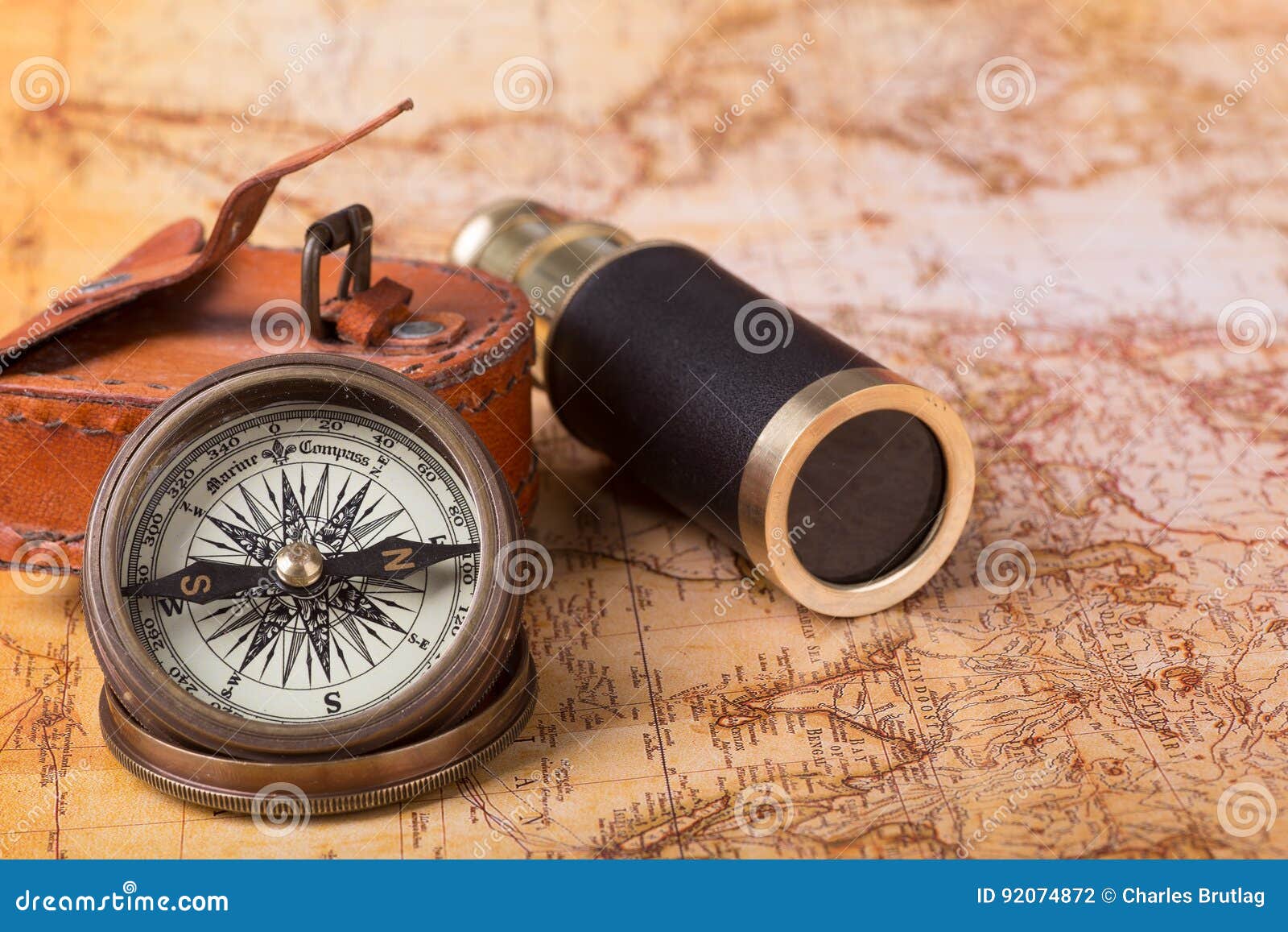 Brass Compass on a Map stock photo. Image of rustic, explore - 92074872