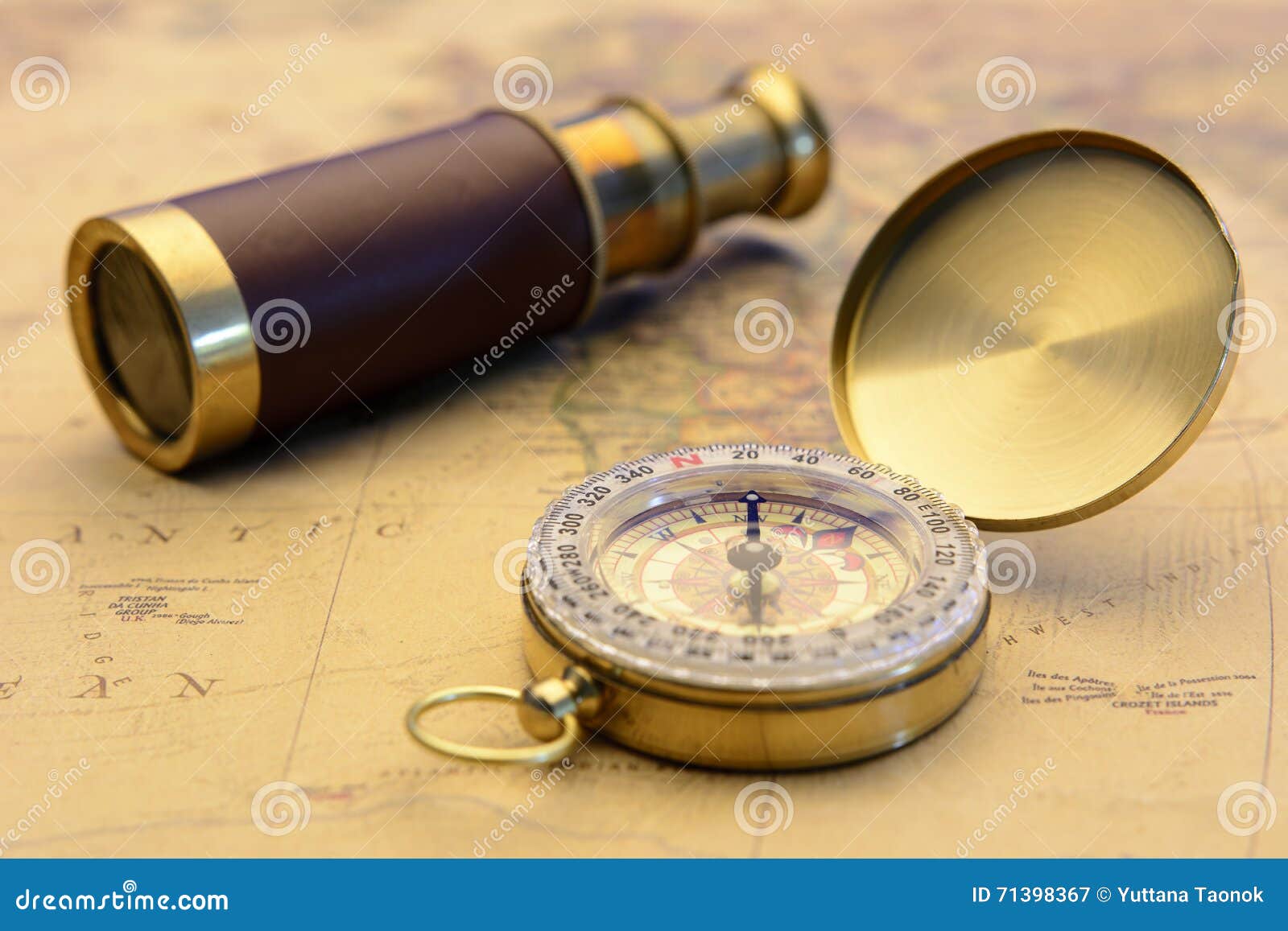 Brass Compass and Old Telescope on Vintage Map World Explorer Concept ...