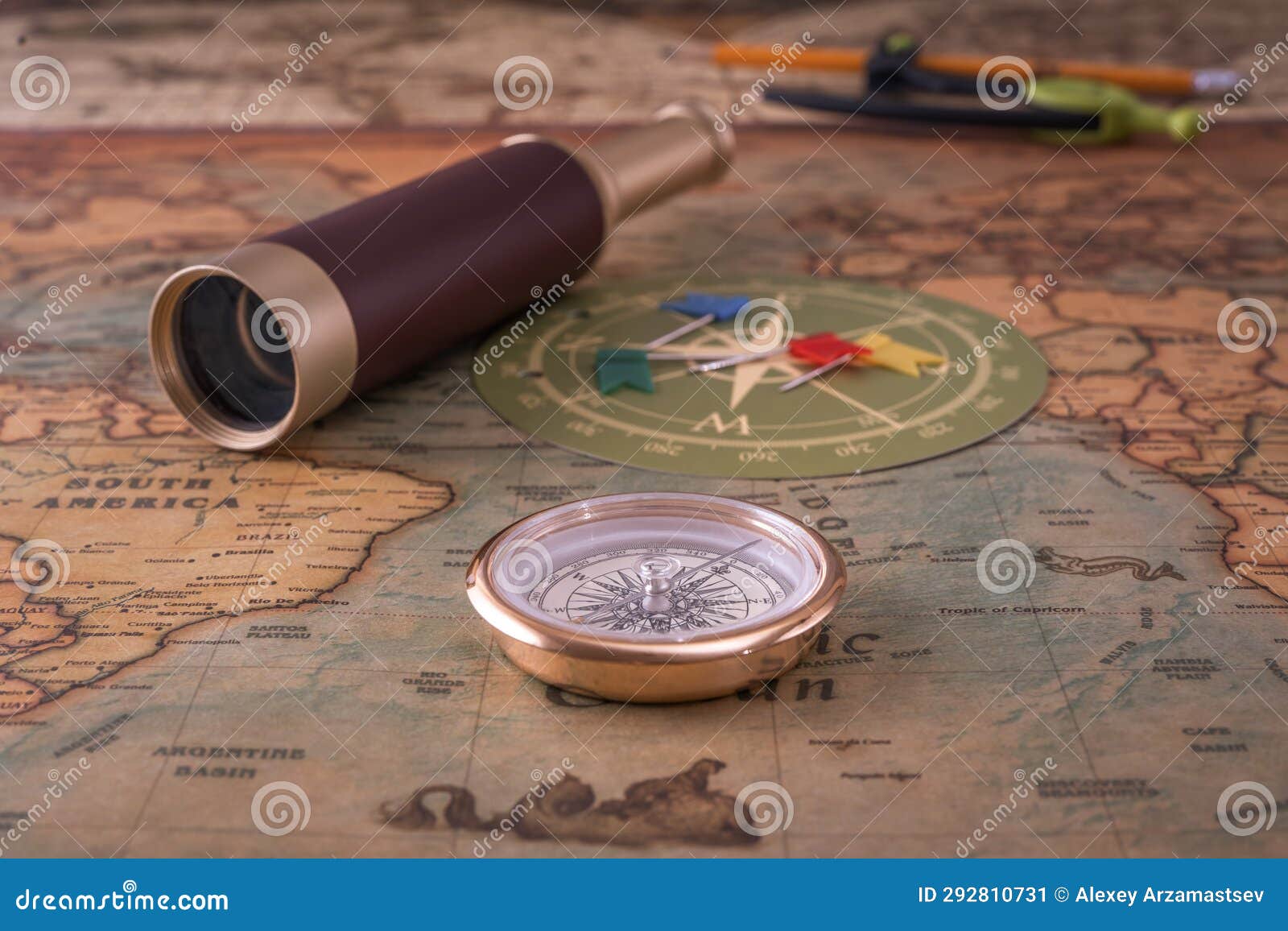 Brass Compass, a Spyglass, a Pencil with a Compass and Multi-colored ...