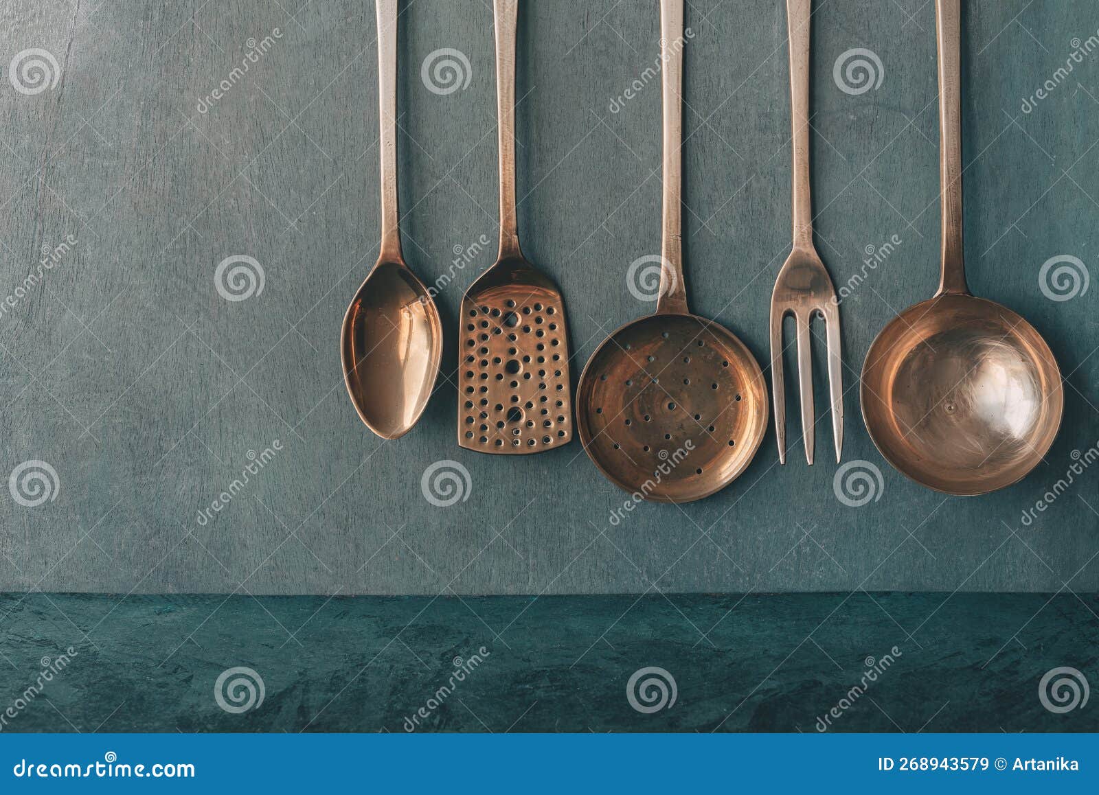 Brass Kitchen Utensil on the Wall Stock Image - Image of cooking, metal ...