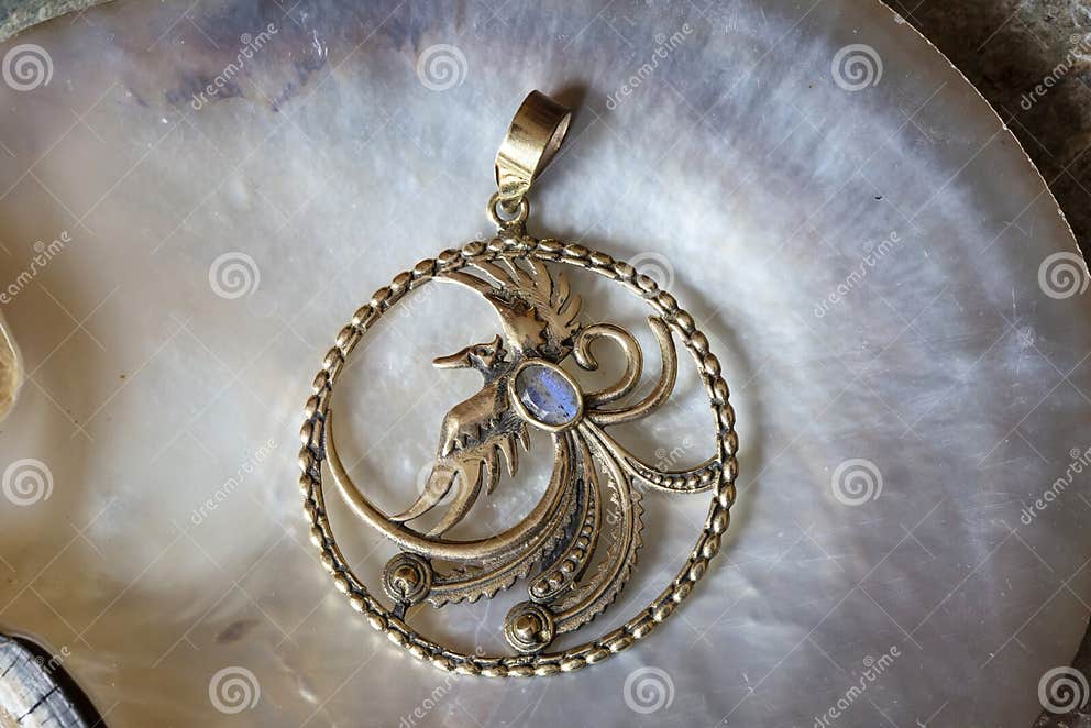 Phoenix Labradorite Stone Pendatnt on White Shell Background Stock ...