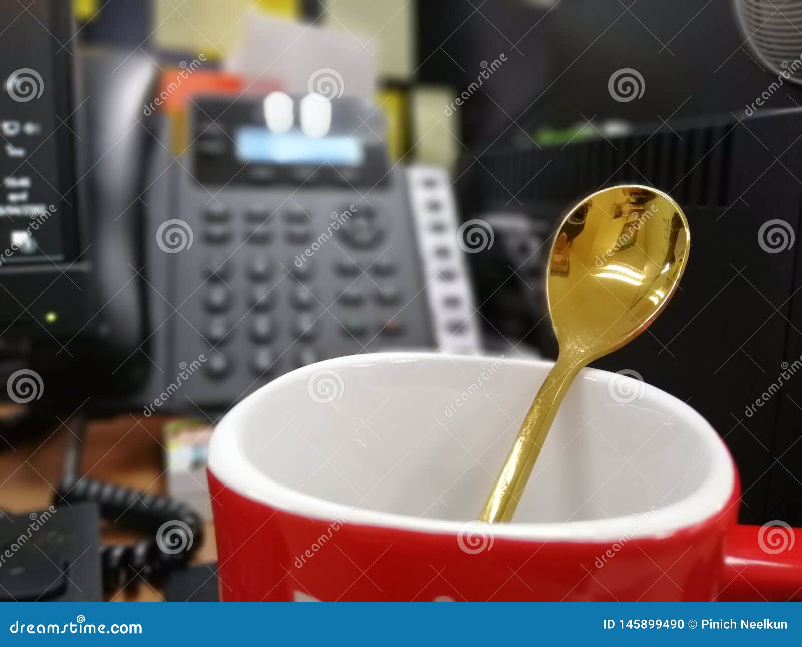 Brass Spoon in a Cup of Coffee, Placed on a Computer Table Stock Photo ...